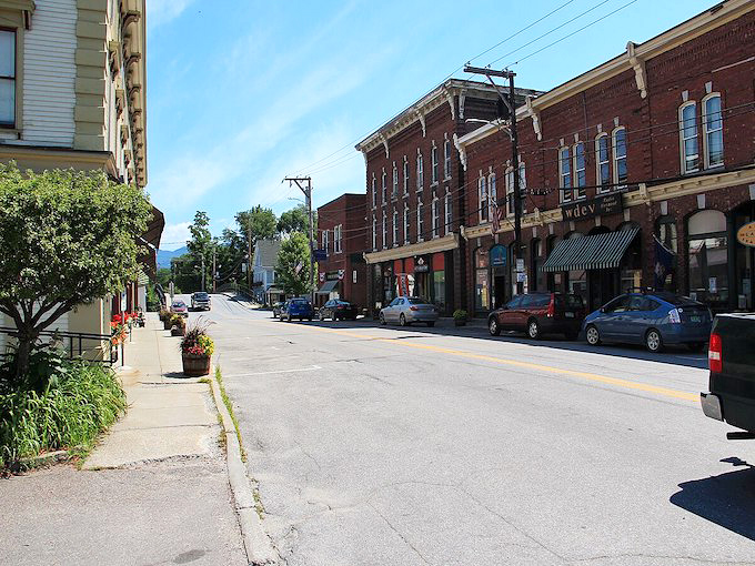 Waterbury, Vermont's Main Street stretches before you like a Norman Rockwell painting come to life – except with better restaurants and fewer awkward family dynamics.