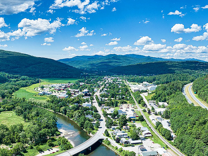 The Green Mountains embrace this historic Vermont village like nature's own welcome committee, creating views that make you understand why people write songs about this place.