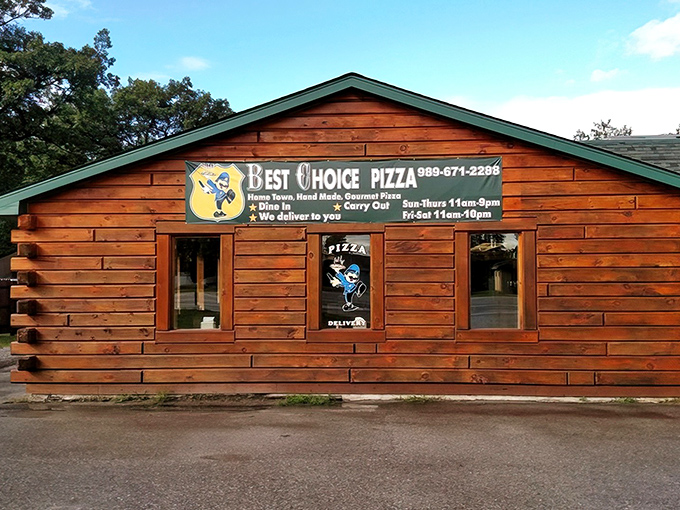 Rustic log cabin charm meets pizza perfection at Best Choice Pizza's wooden exterior – a true hidden gem waiting to be discovered.