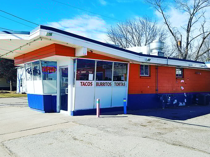 The unassuming orange and blue exterior of Taco Paisa stands like a colorful beacon of flavor in Sparta, promising authentic Mexican delights within.