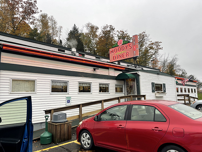 The iconic Moody's Diner sign beckons travelers with a promise of comfort food and nostalgia along Maine's Route 1.