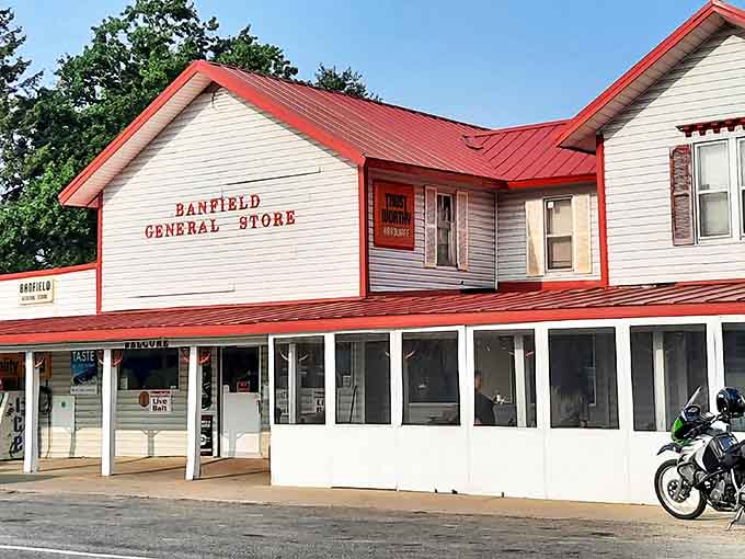 The Banfield General Store stands proudly with its distinctive red roof and welcoming porch &ndash; a beacon of small-town charm that's been serving hungry travelers for generations.