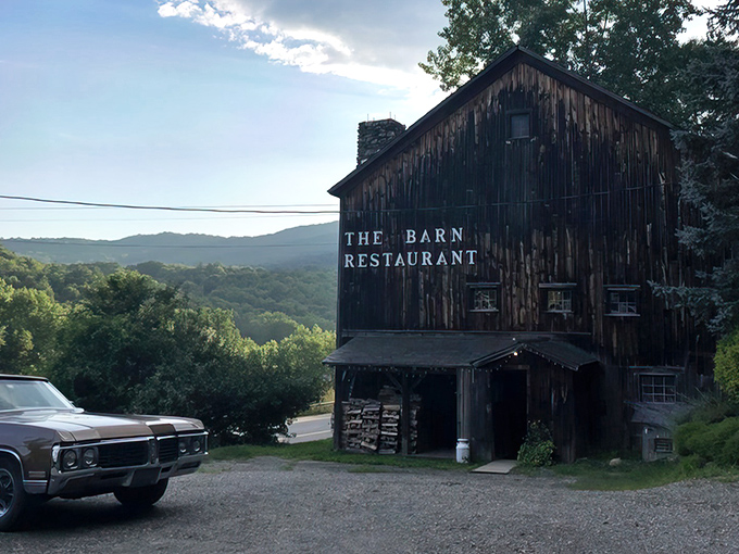 Rustic charm meets culinary excellence at The Barn Restaurant, where weathered wood frames breathtaking Vermont vistas.