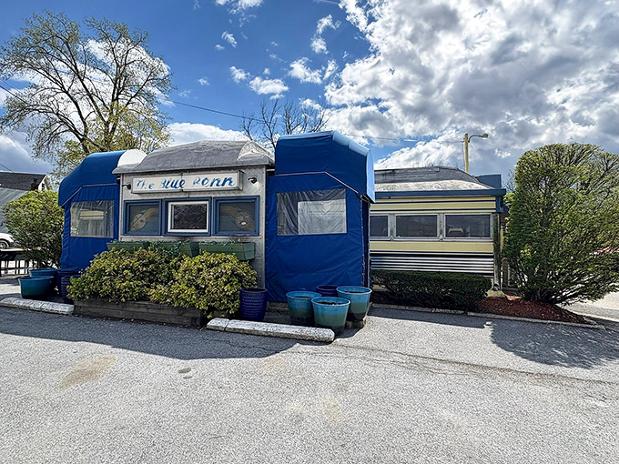 The iconic blue exterior of the Blue Benn Diner stands proudly along Route 7, a Worcester Lunch Car Company original that's become a Vermont landmark.