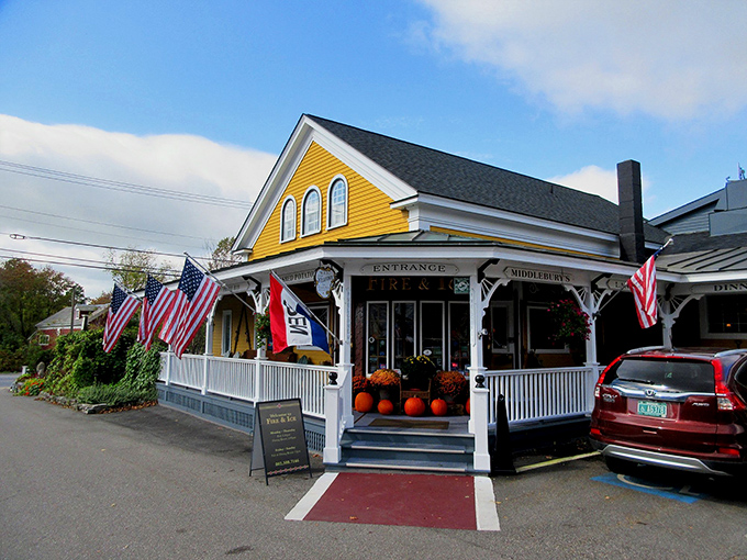 The sunshine-yellow exterior of Fire & Ice welcomes hungry travelers with American flags fluttering above a classic New England porch &ndash; Vermont hospitality at its finest.