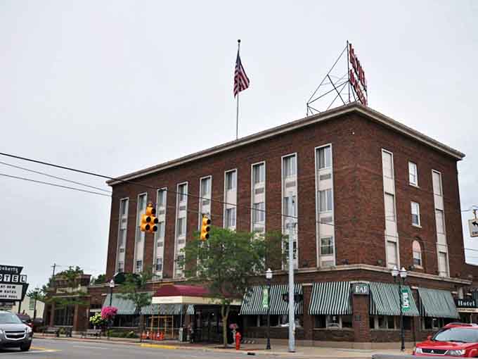 The iconic brick exterior of the Doherty Hotel stands proudly in downtown Clare, its vintage charm beckoning travelers with promises of history and hospitality.