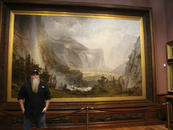 That enormous landscape painting requires a person standing next to it for scale, otherwise you might think it's just a regular-sized painting in a tiny room.