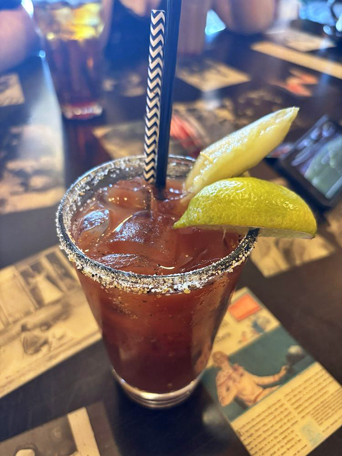 The Bloody Mary comes perfectly spiced with a salt rim and lime wedge &ndash; weekend brunch's ideal companion for literary discussions.