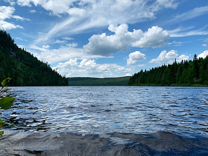 Summer's perfect day captured in liquid form – this blue lake sparkles like it's hiding diamonds beneath its surface.