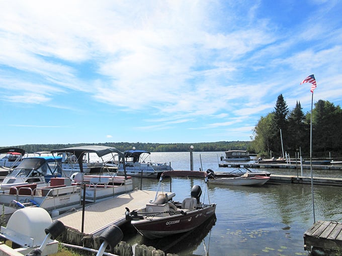 Boats rest peacefully at their moorings, waiting for tomorrow's adventures on this crystal-clear international waterway.