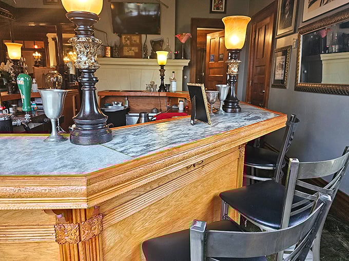 The bar's marble countertop and ornate woodwork create a cozy nook where mixologists craft cocktails worthy of the castle's storied past.