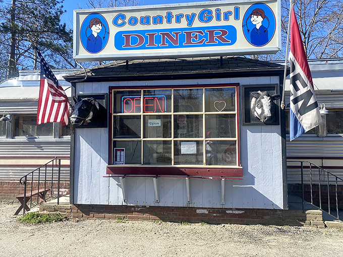 Country Girl Diner's classic chrome exterior promises authentic comfort food inside &ndash; the kind that makes diet plans disappear faster than their homemade pie.