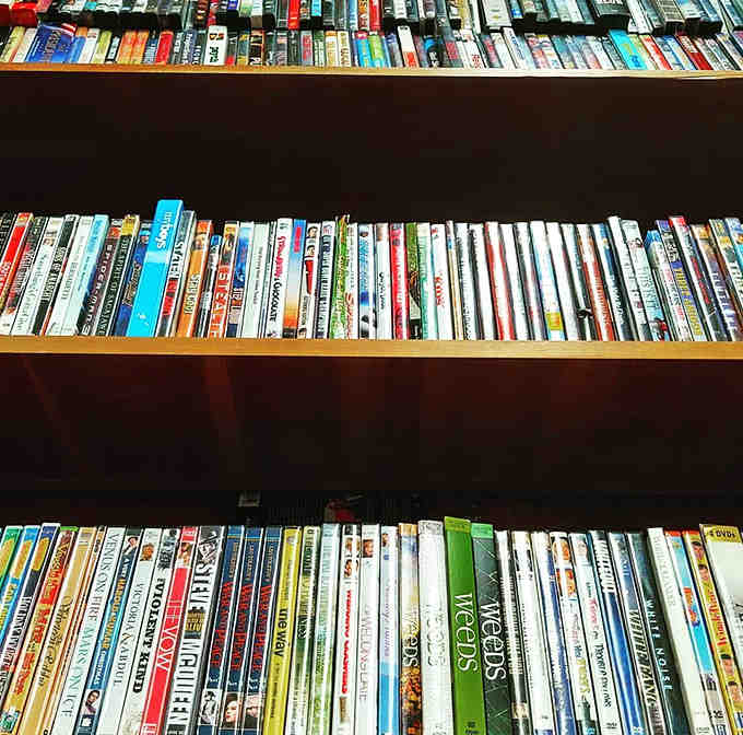 DVDs stand in neat rows, a physical archive of cinematic history that streaming services can never fully replicate in their digital catalogs.
