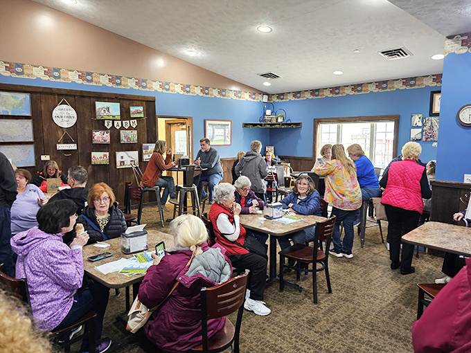 Generations gather around tables in animated conversation &ndash; proof that Moo-Ville isn't just serving ice cream, it's creating community one scoop at a time.
