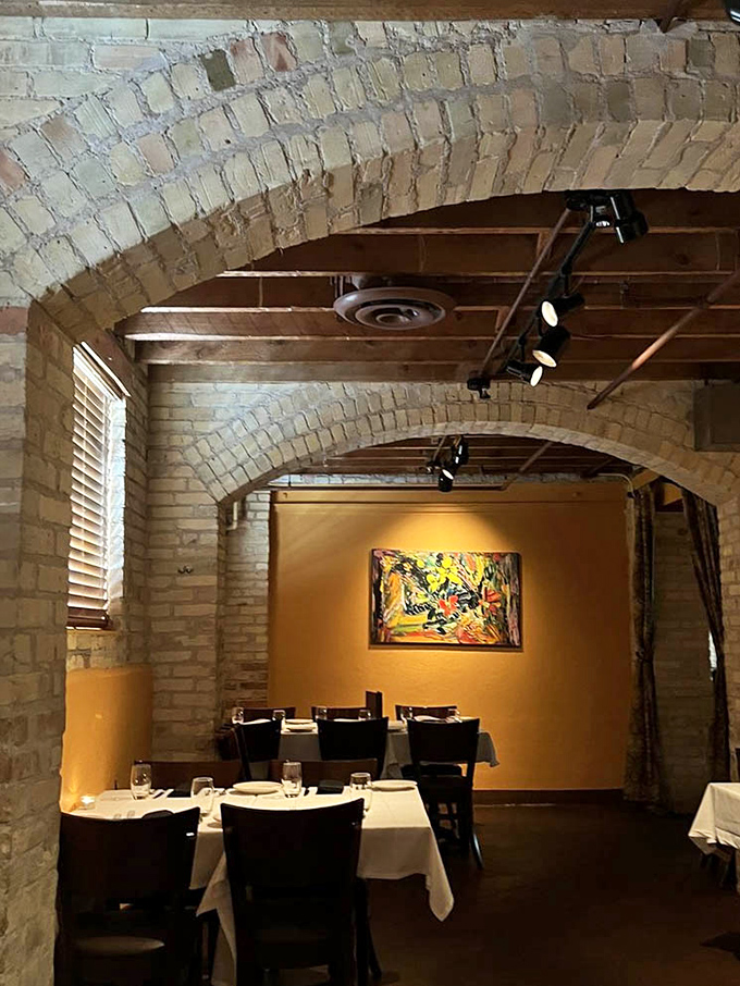 Arched brick ceilings frame the dining space like a Renaissance painting, turning a simple meal into a brush with architectural history.