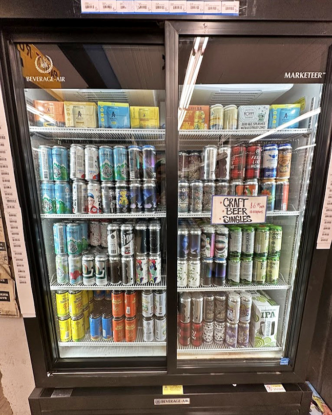 The beverage cooler showcases Vermont craft beers alongside national brands, a democratic display of drinking options for every palate.