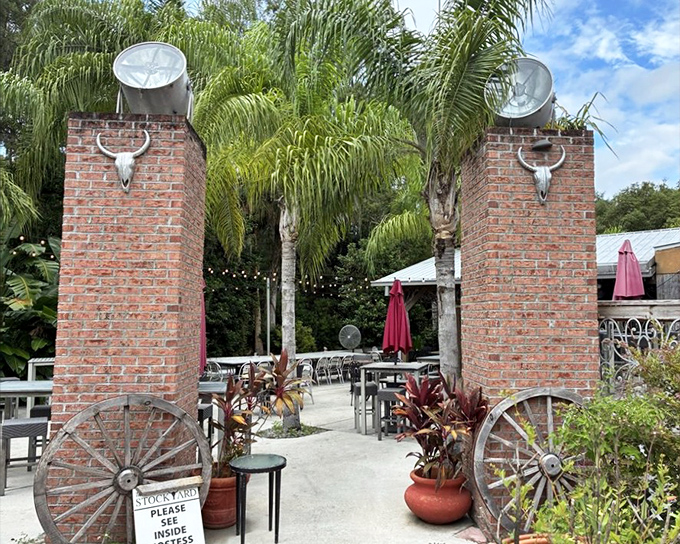 The entrance to the patio feels like stepping into a Western film set, complete with brick pillars and cattle skulls&mdash;pure Florida meets frontier charm.