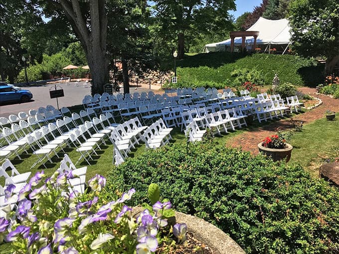 Outdoor event spaces prove that nature plus castle equals a wedding backdrop that requires zero additional decoration.