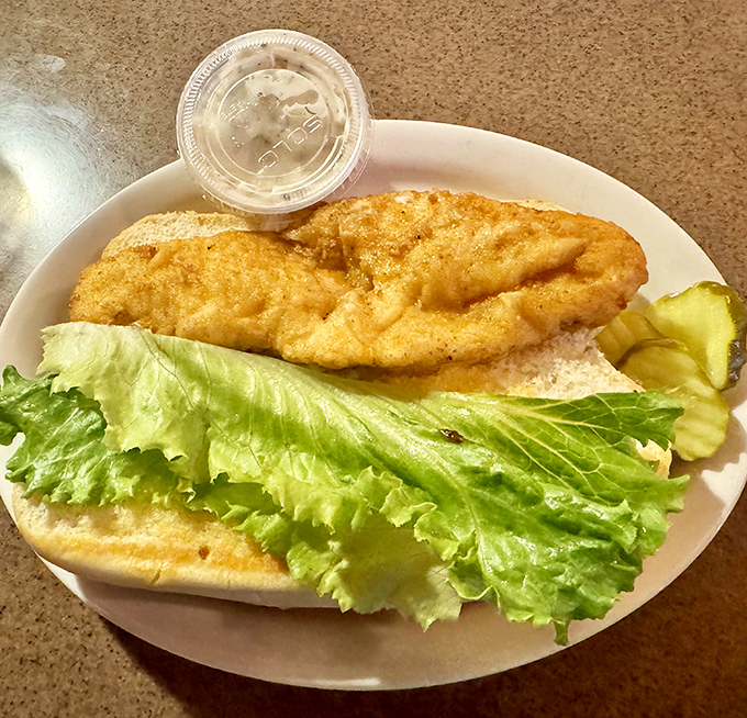 Fresh catch meets crisp lettuce on a pillowy bun&mdash;seafood simplicity that delivers big on flavor.