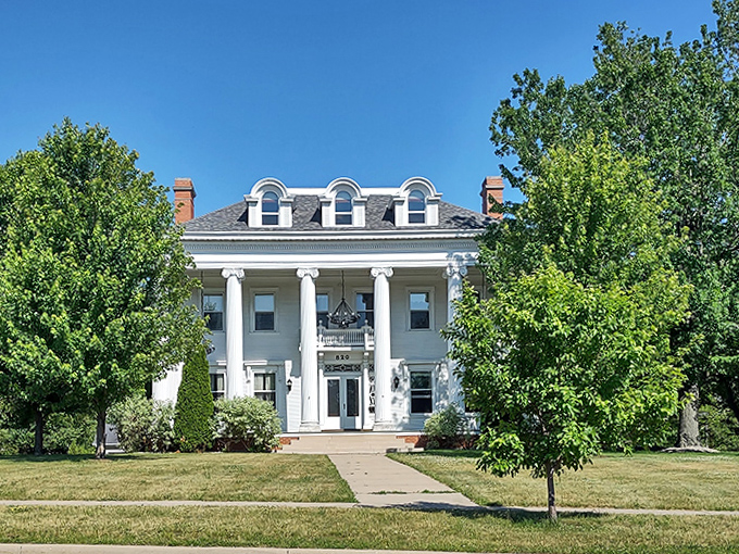 Stately columns and perfect symmetry &ndash; this grand white house stands as an architectural reminder of Wisconsin Rapids' prosperous paper mill era.