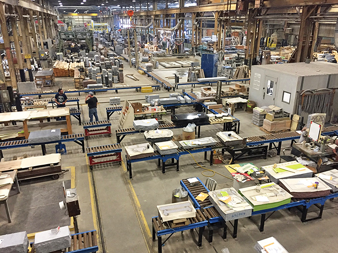 Inside the granite quarry, visitors witness the massive scale of operations where blocks weighing tons are precisely cut from Vermont's bedrock.