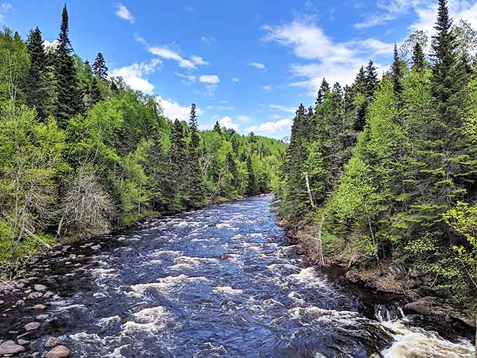 The rushing waters of the Brule River carve their way through ancient rock toward Lake Superior's vastness.