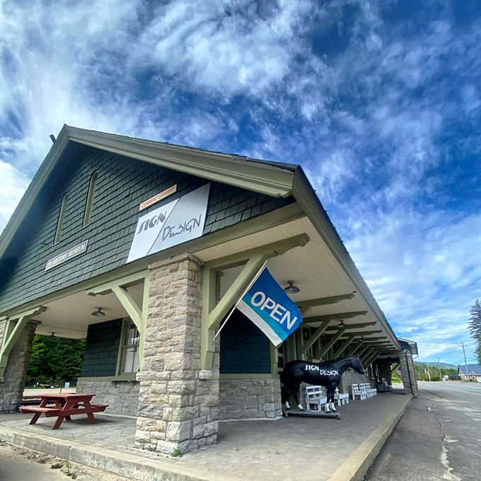 Sign Design's storefront shows that even practical businesses can have a little architectural flair in this artistic town.