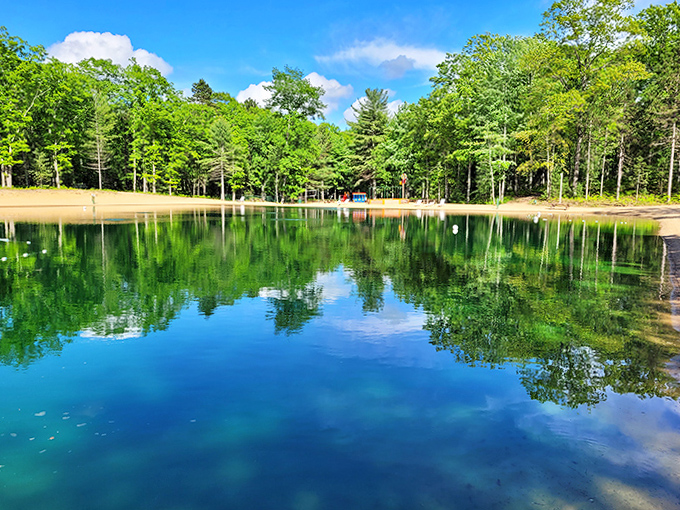 Mirror-like waters reflect the surrounding forest, creating a double dose of natural beauty at this tranquil lakeside retreat.
