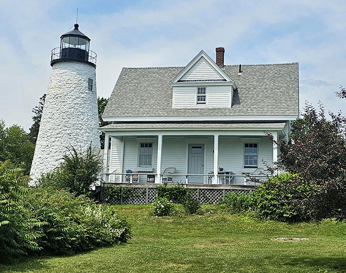 Dyce Head Lighthouse keeps its silent watch, a white exclamation point against Maine's evergreen coastline.