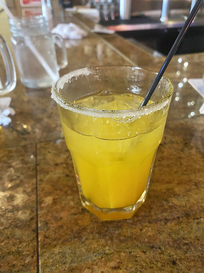 A mango margarita with that salt rim is like sunshine in a glass. The perfect companion for washing down a hearty steak dinner.