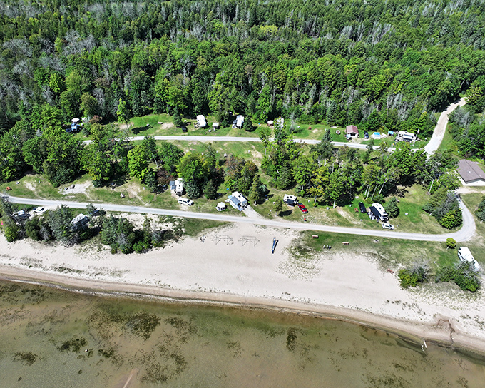 O.B. Fuller County Park offers campsites nestled among trees with Lake Michigan's shoreline just steps away, nature's perfect lullaby.