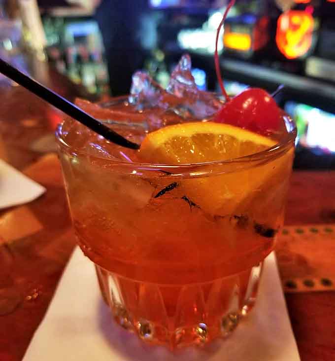 Old fashioned cocktail garnished to perfection, because sometimes you need liquid courage when dining with ghosts.