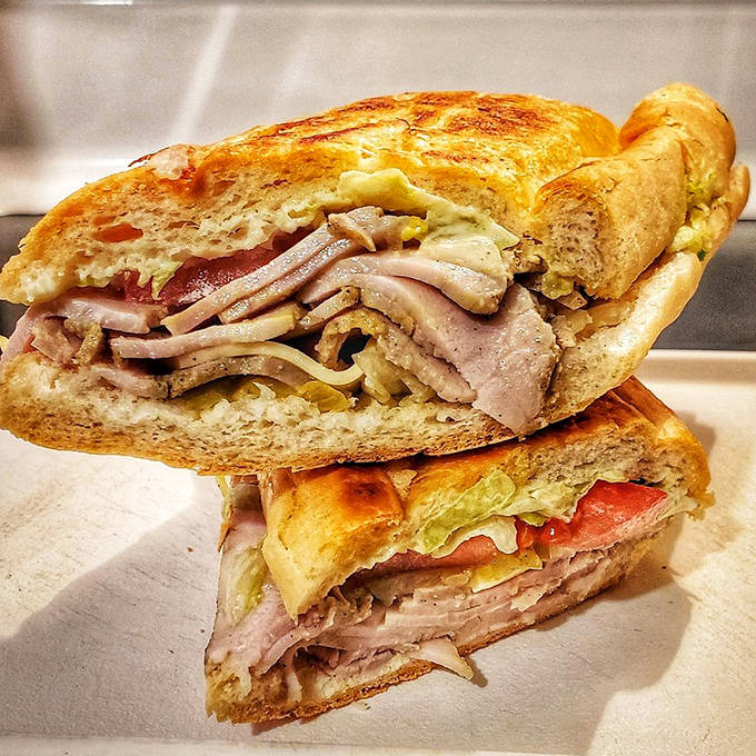Cross-section perfection! The layering technique is revealed in this Cuban sandwich &ndash; each ingredient visible yet melding together in harmonious sandwich architecture.