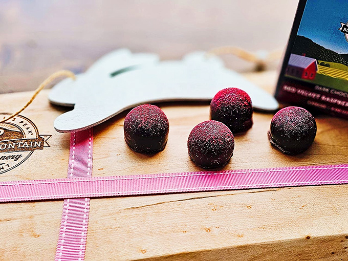 Red and gold truffle jewels that make you realize regular candy has been lying to you your entire life about what chocolate can be.