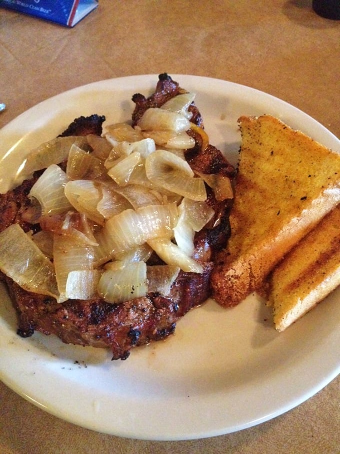 A juicy ribeye topped with saut&eacute;ed onions &ndash; simple perfection that needs no fancy description, just your undivided attention.