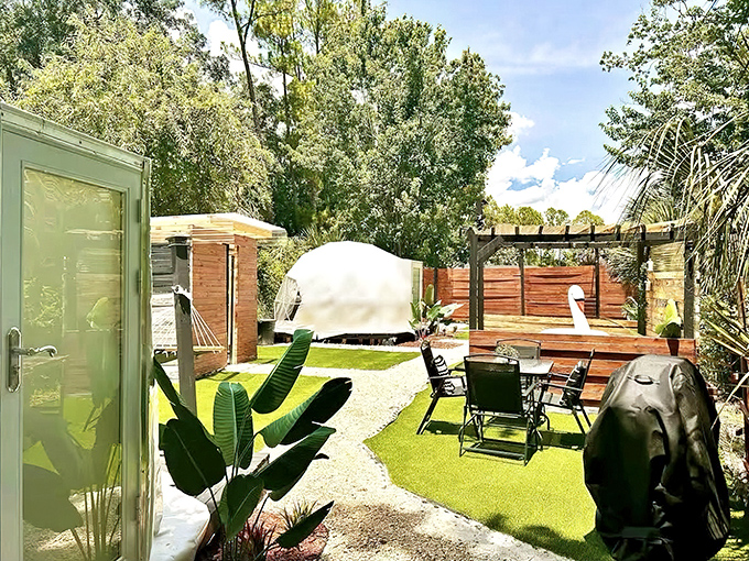 A backyard that puts suburban landscaping to shame &ndash; where artificial turf meets natural beauty in perfect Florida harmony.