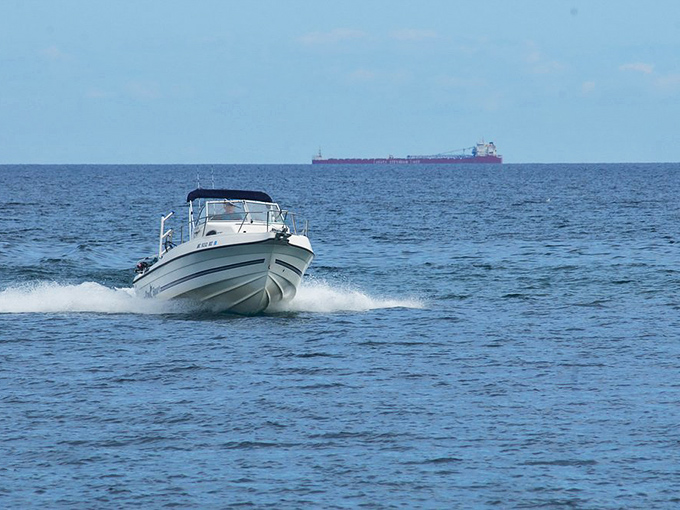 Making waves in prehistoric waters &ndash; modern vessels skim across the same lake that once harbored ancient marine creatures.
