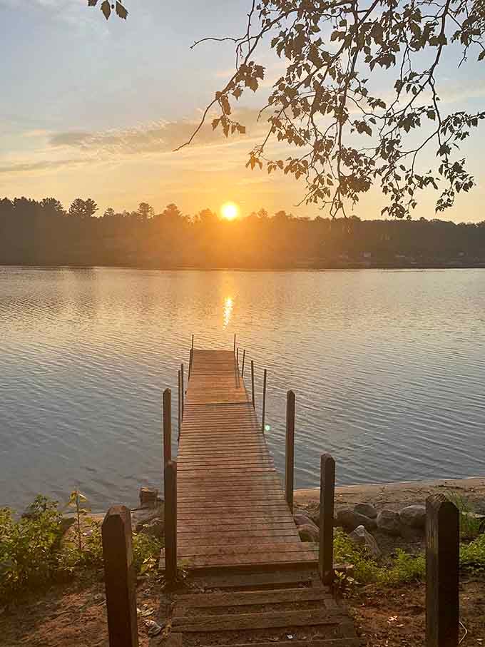 Sunset at Wilson State Park turns Budd Lake into liquid gold, creating the kind of moment that makes you forget to check your phone.