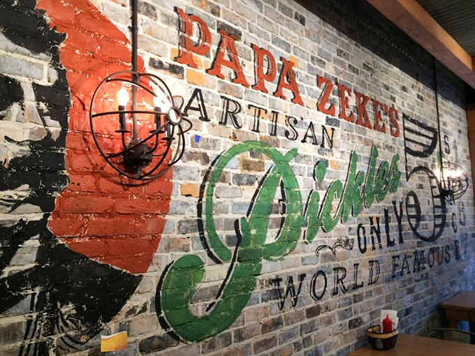 The vintage-inspired brick wall art celebrates pickle craftsmanship with a nod to tradition in this modern culinary hotspot.