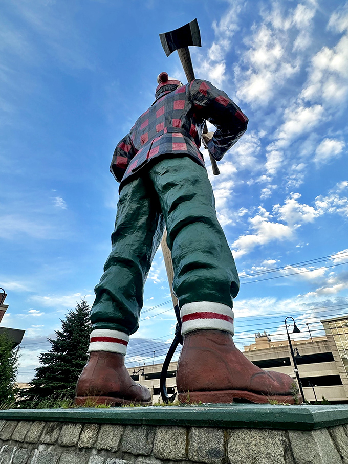 The peavey tool in Paul's hand is authentic to logging history, a detail appreciated by those familiar with lumber work.