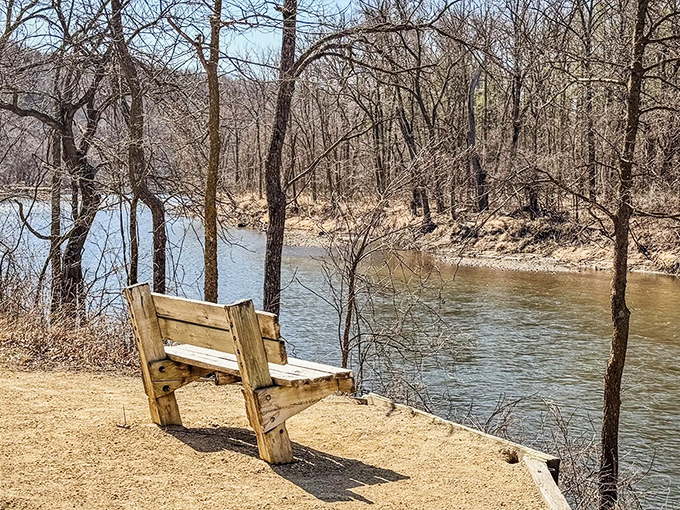 A simple wooden bench offers the perfect spot to pause and soak in river views, nature's version of front-row seating.
