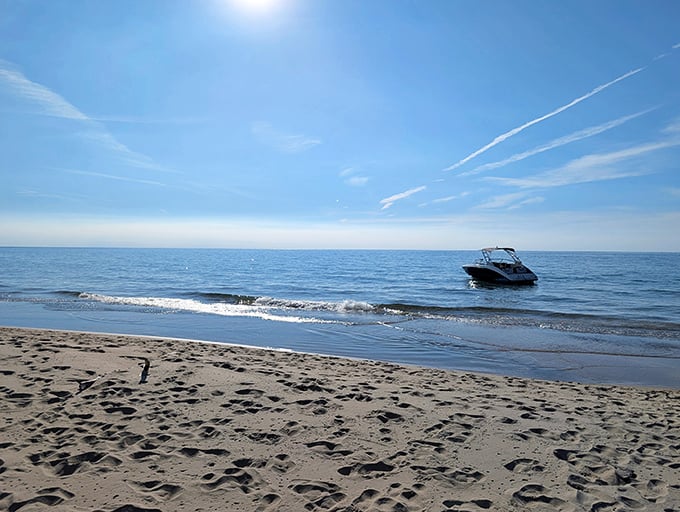 Crystal waters invite exploration while a boat skims the horizon &ndash; adventures await both on shore and beyond.
