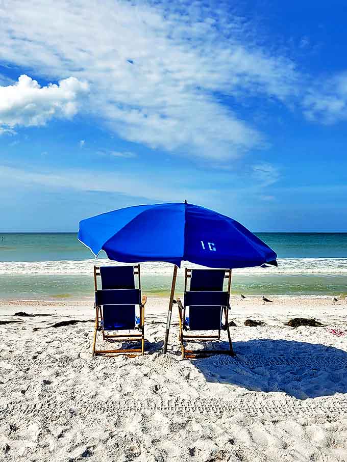 Perfect simplicity: Two empty chairs beneath a blue umbrella invite visitors to do absolutely nothing at all &ndash; perhaps the island's greatest attraction.
