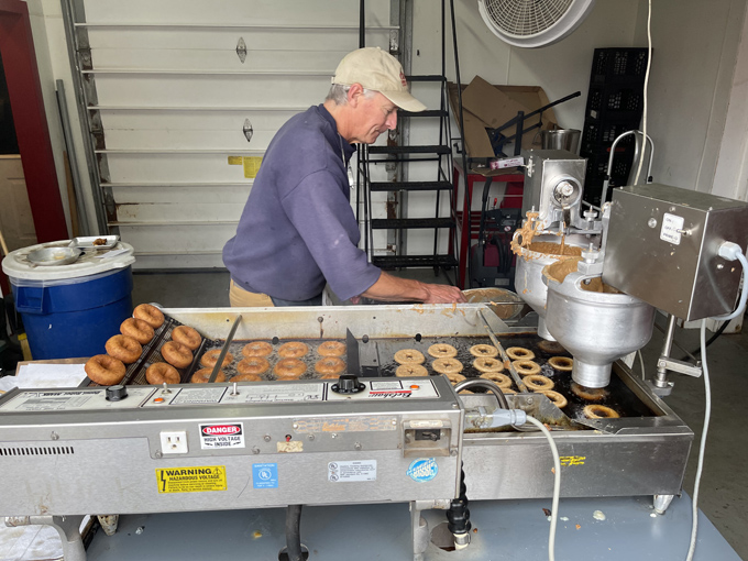 Behind every great donut is a dedicated baker, transforming simple ingredients into rings of joy with practiced precision.