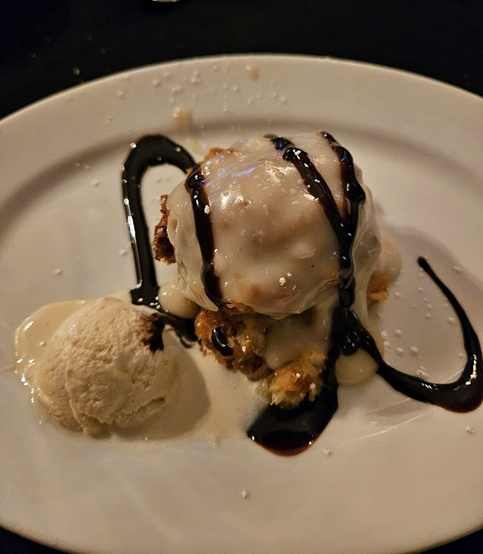 Ice cream melting over warm dessert &ndash; a simple pleasure made extraordinary when enjoyed beneath crystal chandeliers in a historic castle.