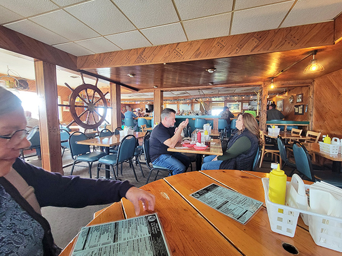 Happy diners enjoying the fruits of The Raft's labor, where conversations flow as freely as the condiments on their perfectly cooked meals.