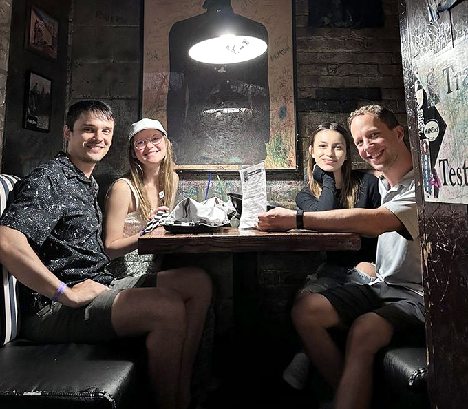 Diners enjoying their covert culinary operations in one of the SafeHouse's many themed dining areas.