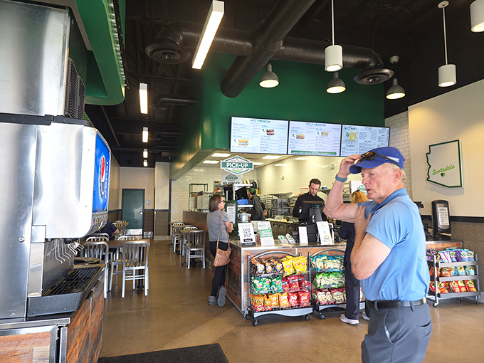 Where sandwich dreams come true &ndash; customers contemplating their next bite in the temple of pickle perfection.