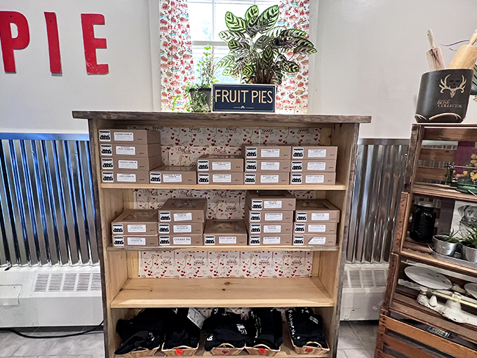 The fruit pie display showcases seasonal treasures in neat rows, each box holding the potential to be the highlight of someone's day.