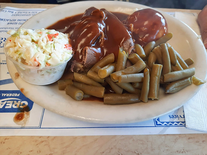 Hot beef swimming in gravy alongside green beans and coleslaw &ndash; comfort food that hugs your insides on even the chilliest Michigan day.